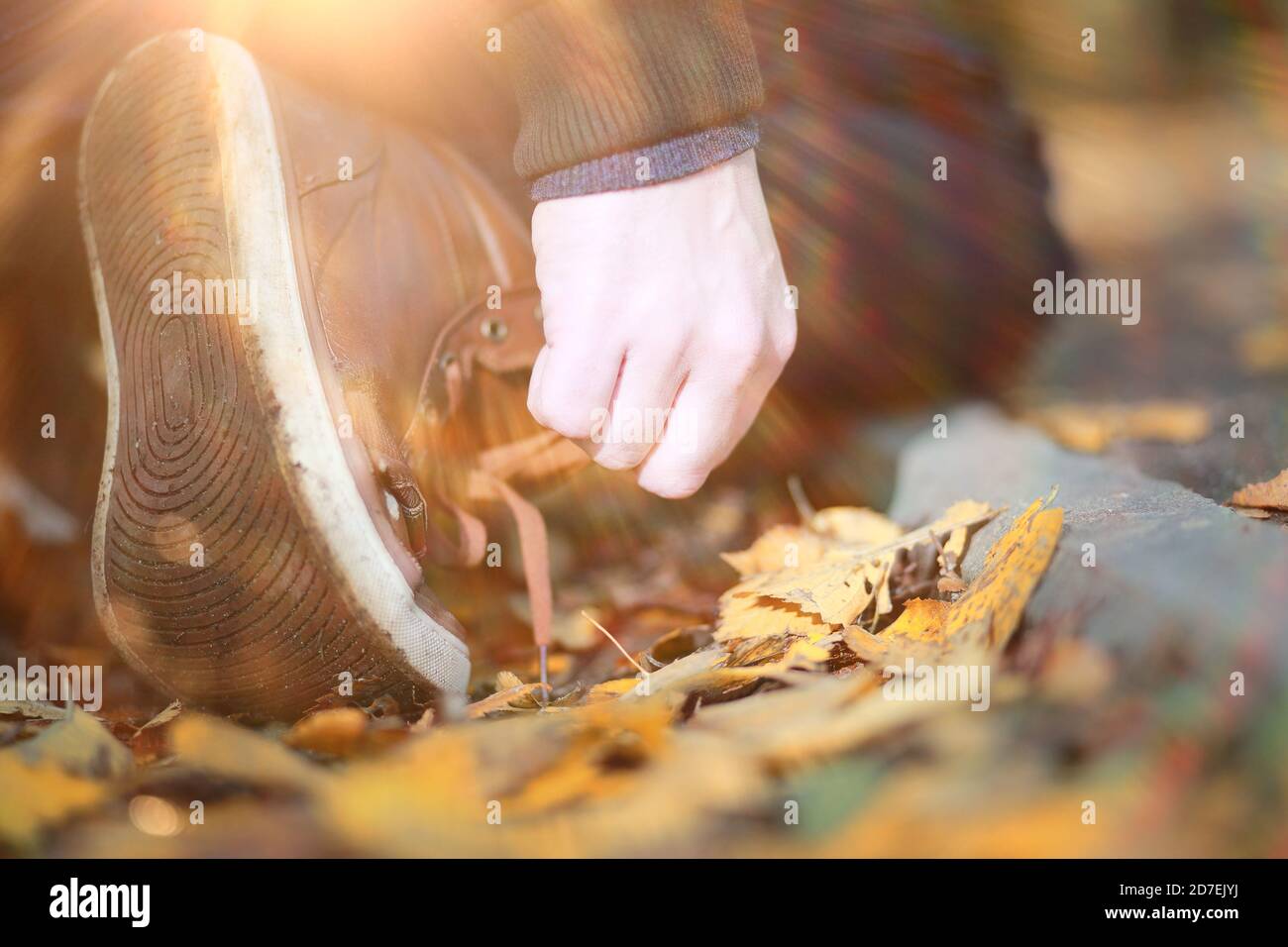 Autumn Park man walking along a path in foliage Stock Photo - Alamy