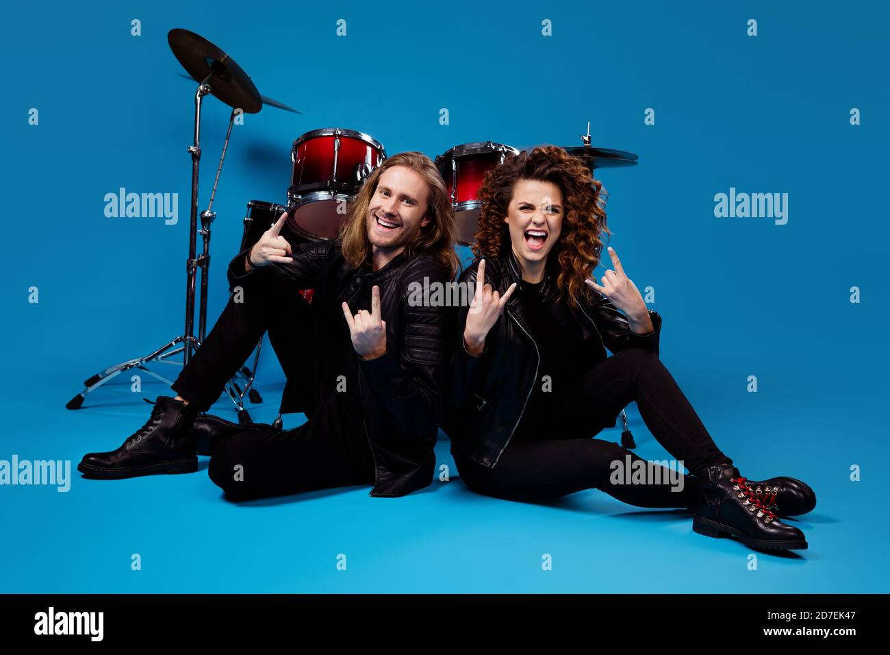 Full length photo of two people girl man sit floor enjoy punk rock star ...