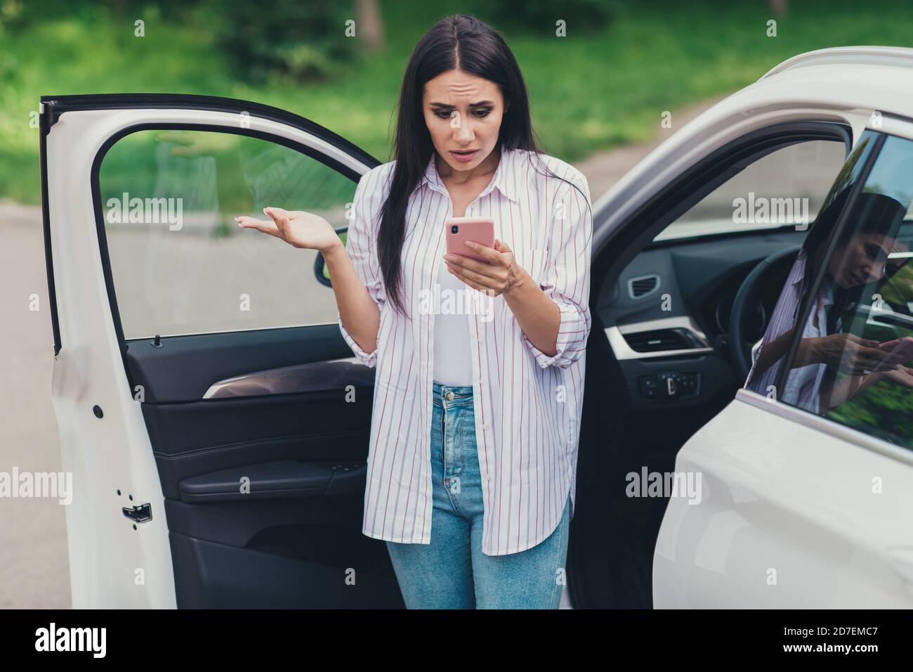 Photo of puzzled girl ride drive city road lost stop car check ...
