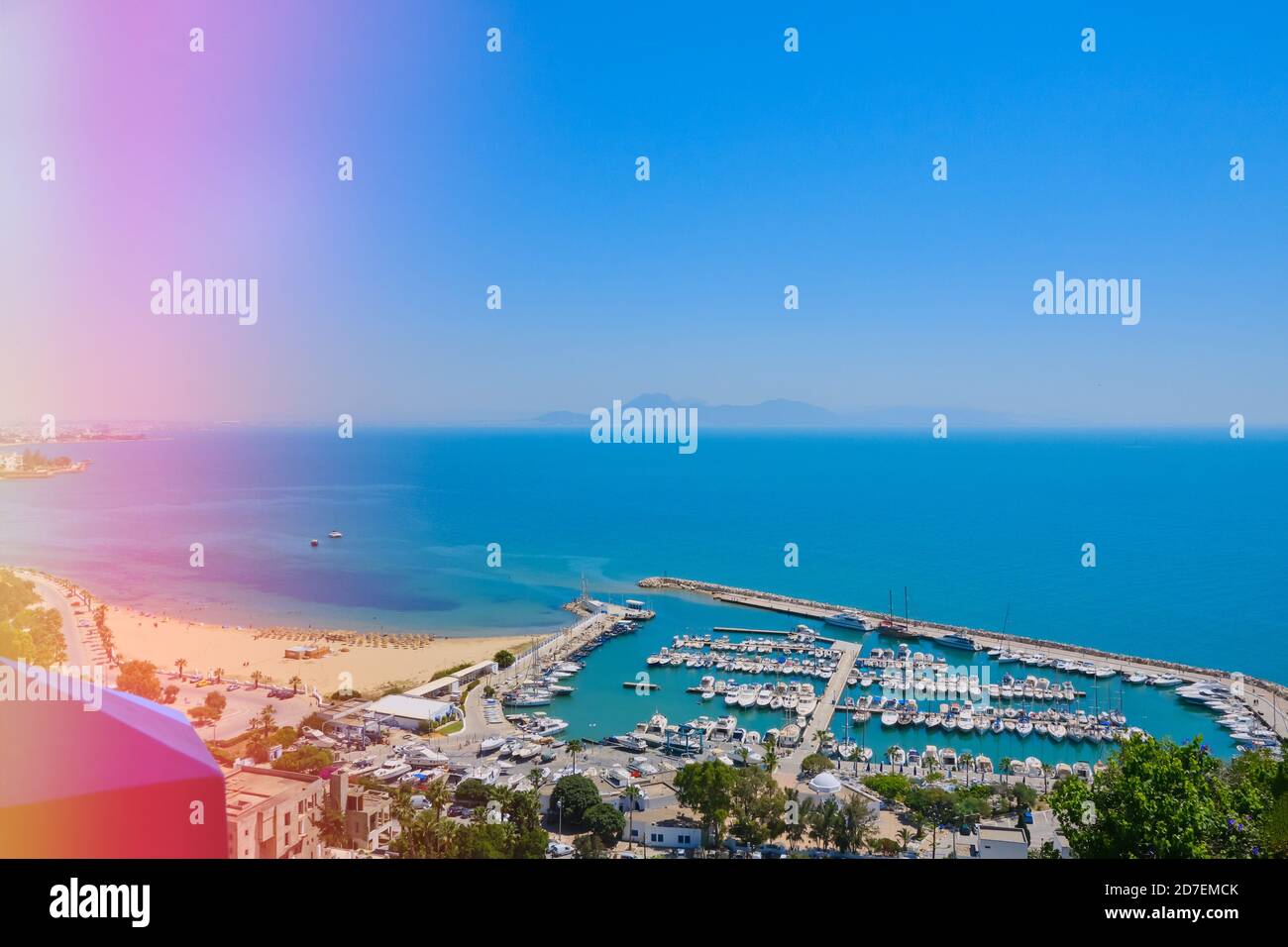 Sea bay, sun, beach and pier with yachts in Sidi Bou Said ...