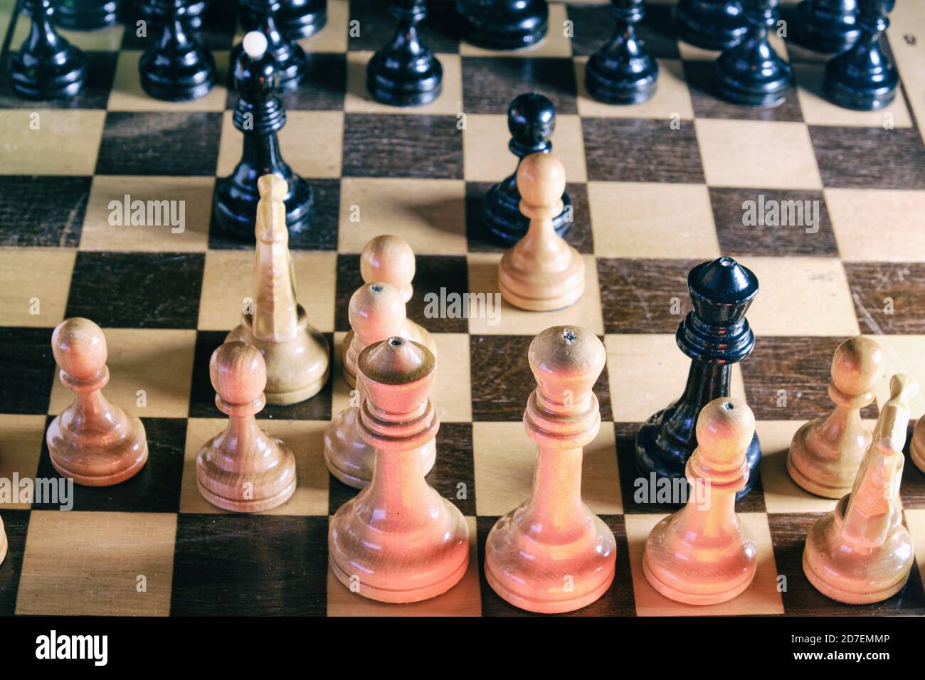 On the chessboard, the black queen checkmated the white king Stock ...