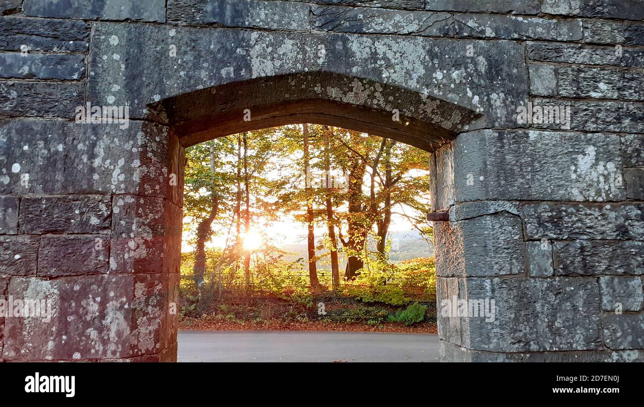 Sunset through the gatehouse to Wray Castle, Ambleside, Lake District ...