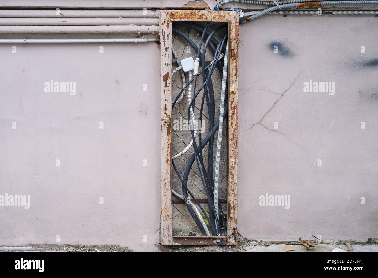 Old electrical wiring on the front of the building Stock Photo - Alamy