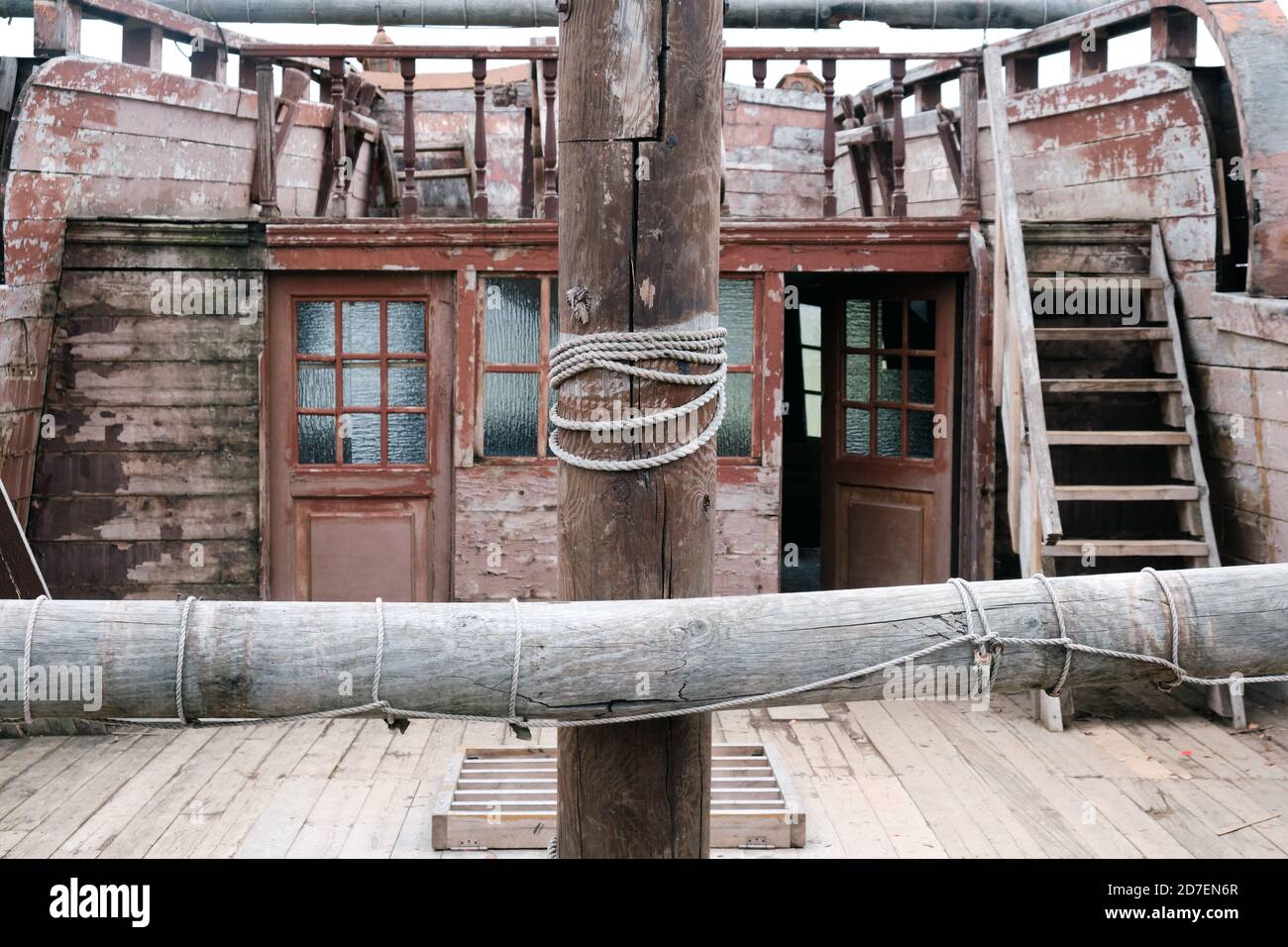 Wooden mast on an ancient sailing ship. Deck of an old pirate frigate ...