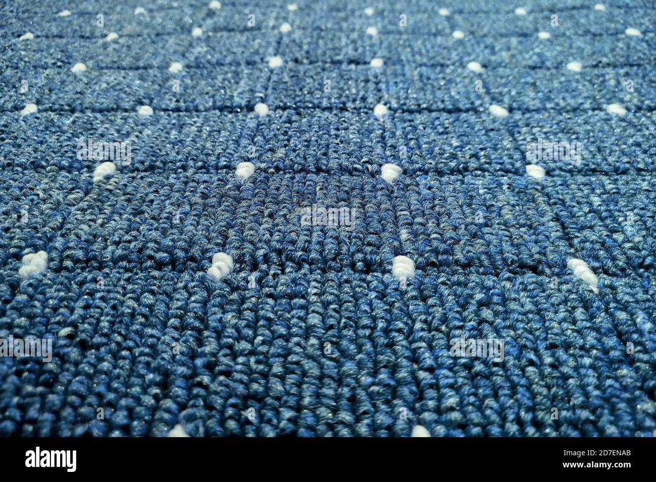 The texture of knitted rug from squares of blue color Stock Photo - Alamy