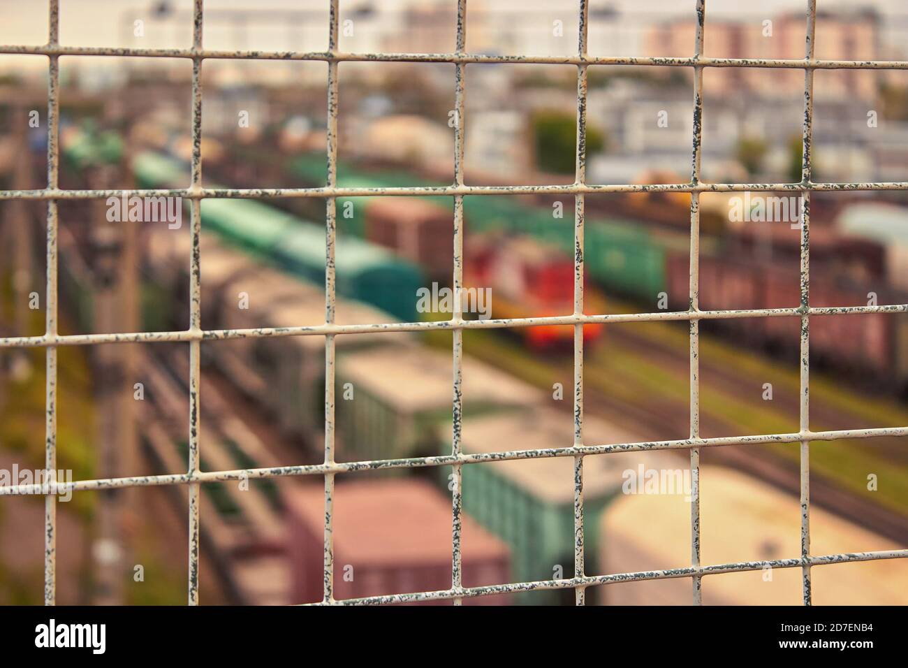 Freight trains and locomotives on the railway, view through the ...