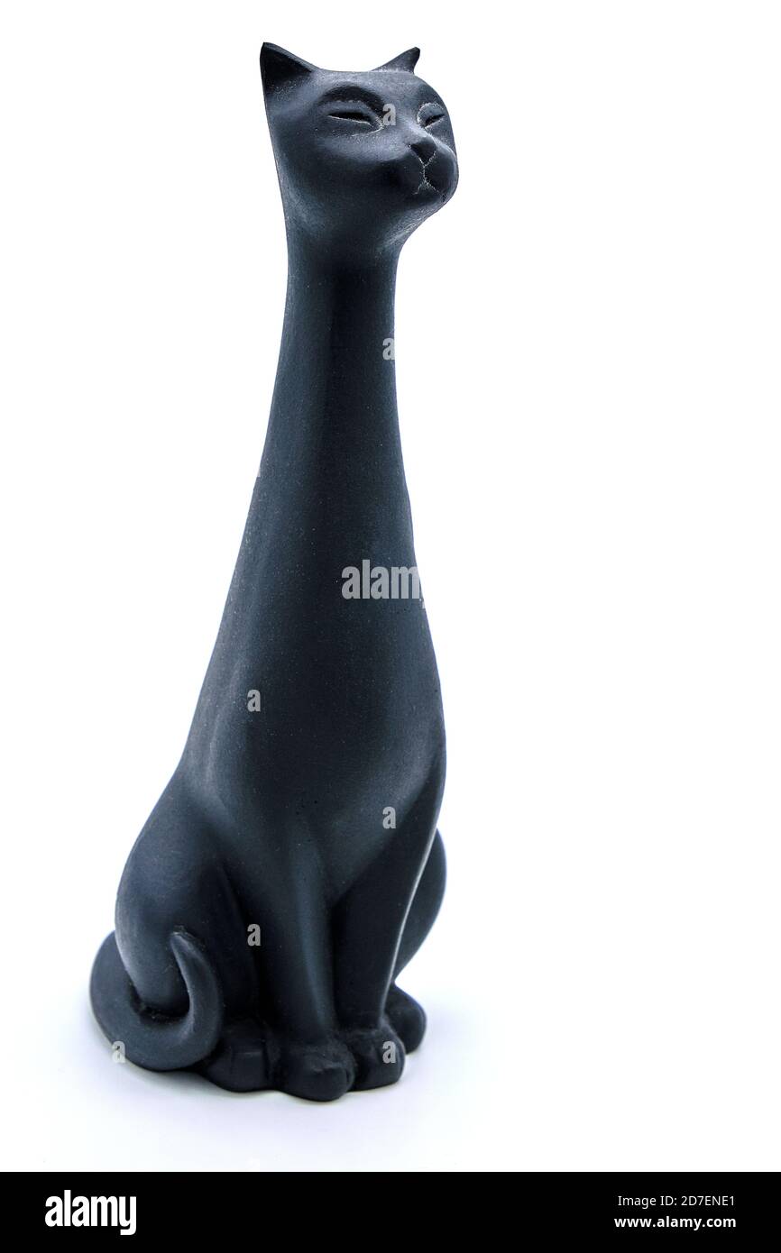 White background, isolate. Statue of a black cat handmade. Figure of a ...