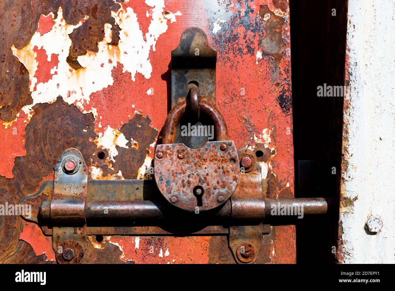 Grunge iron antique lock on a rusty door Stock Photo - Alamy