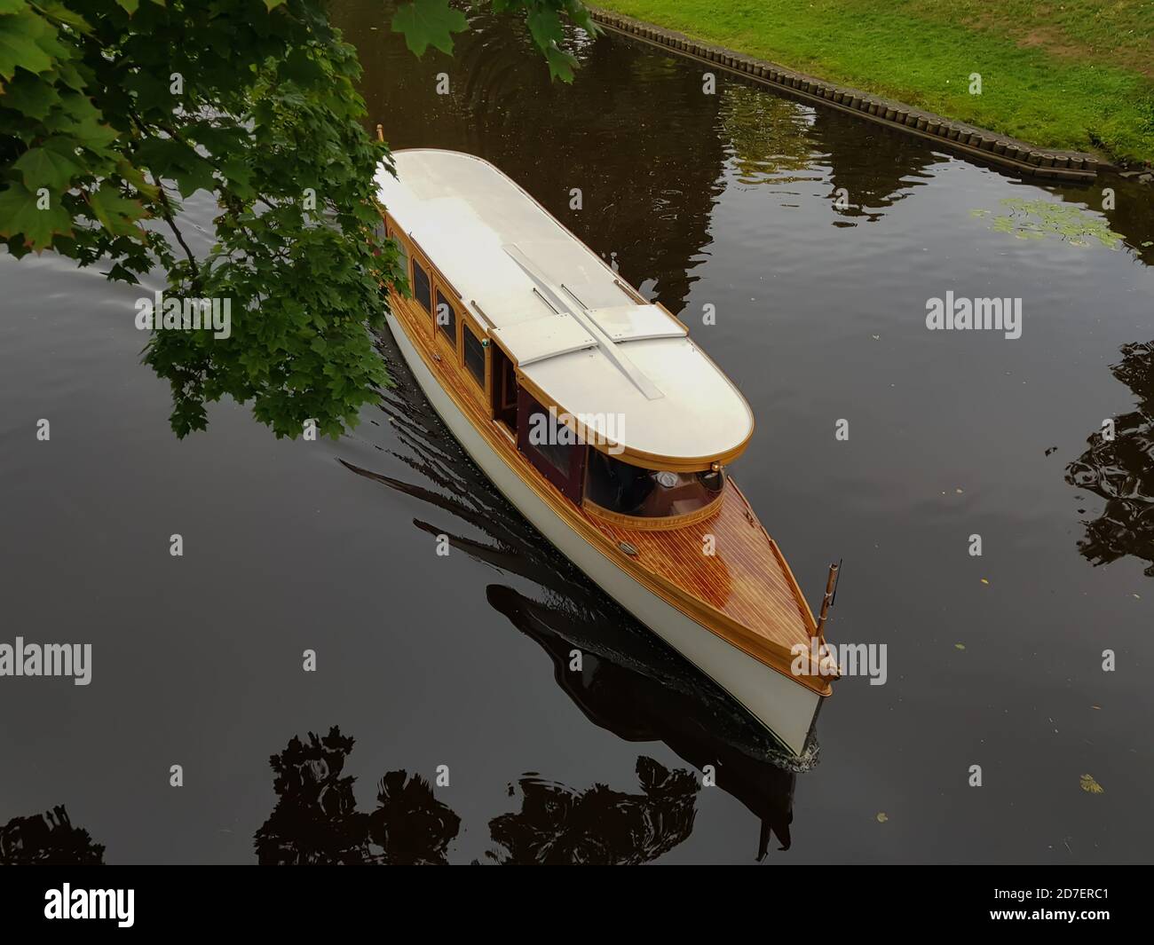boat moves along the water channel in the city Stock Photo - Alamy