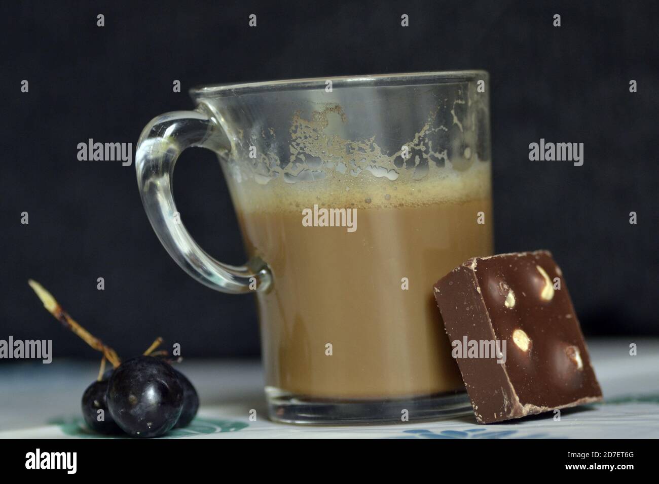 Coffee break with chocolate and grapes Stock Photo - Alamy