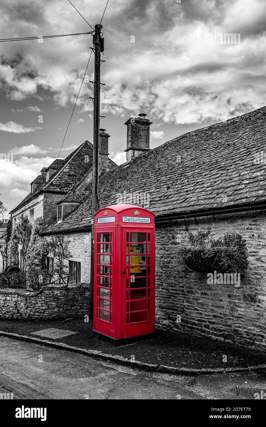 Red telephone box in a village Stock Photo - Alamy