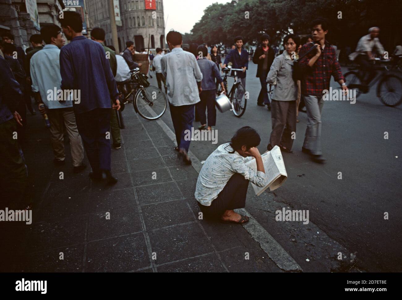 reading newspaper in Guangzhou street, China, 1980 Stock Photo - Alamy
