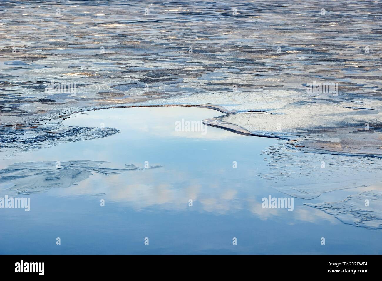 ice crack on frozen lake surface in winter Stock Photo - Alamy