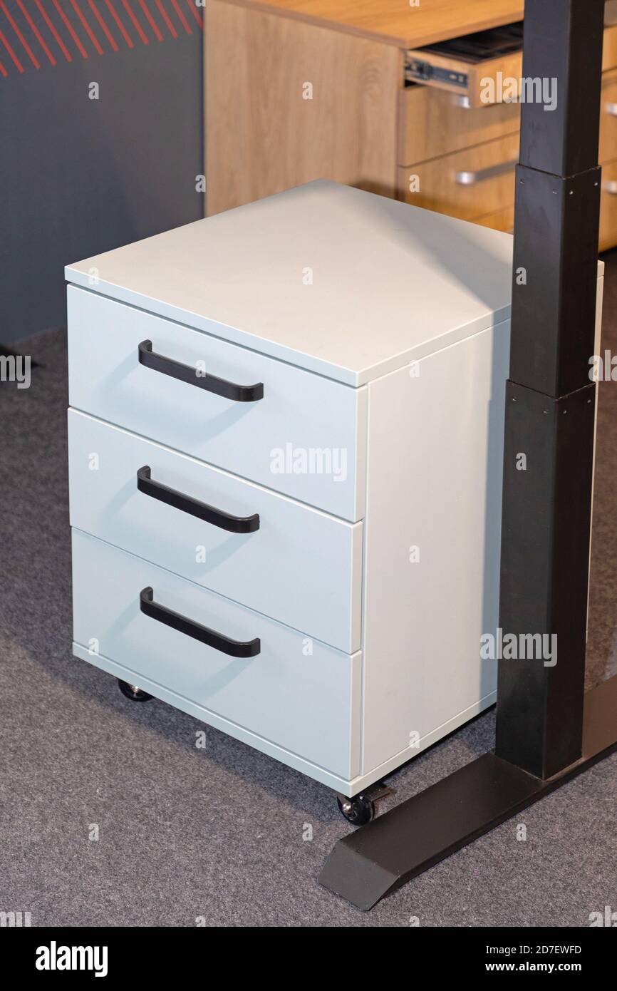 Drawers Cabinet Under Desk in Modern Office Stock Photo - Alamy