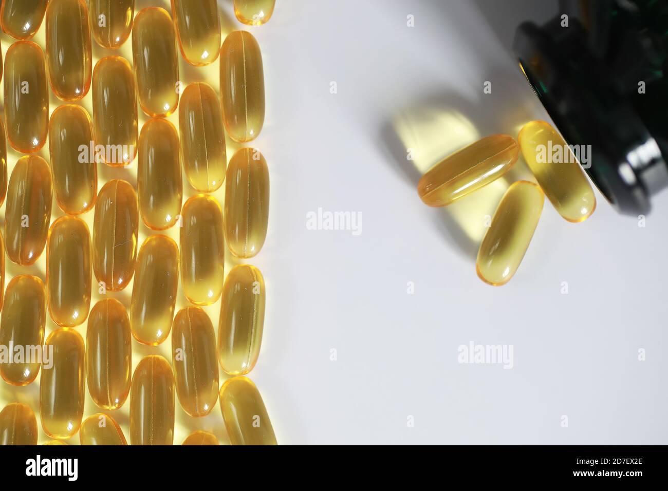 Medical medicines and supplements transparent capsules of yellow color ...