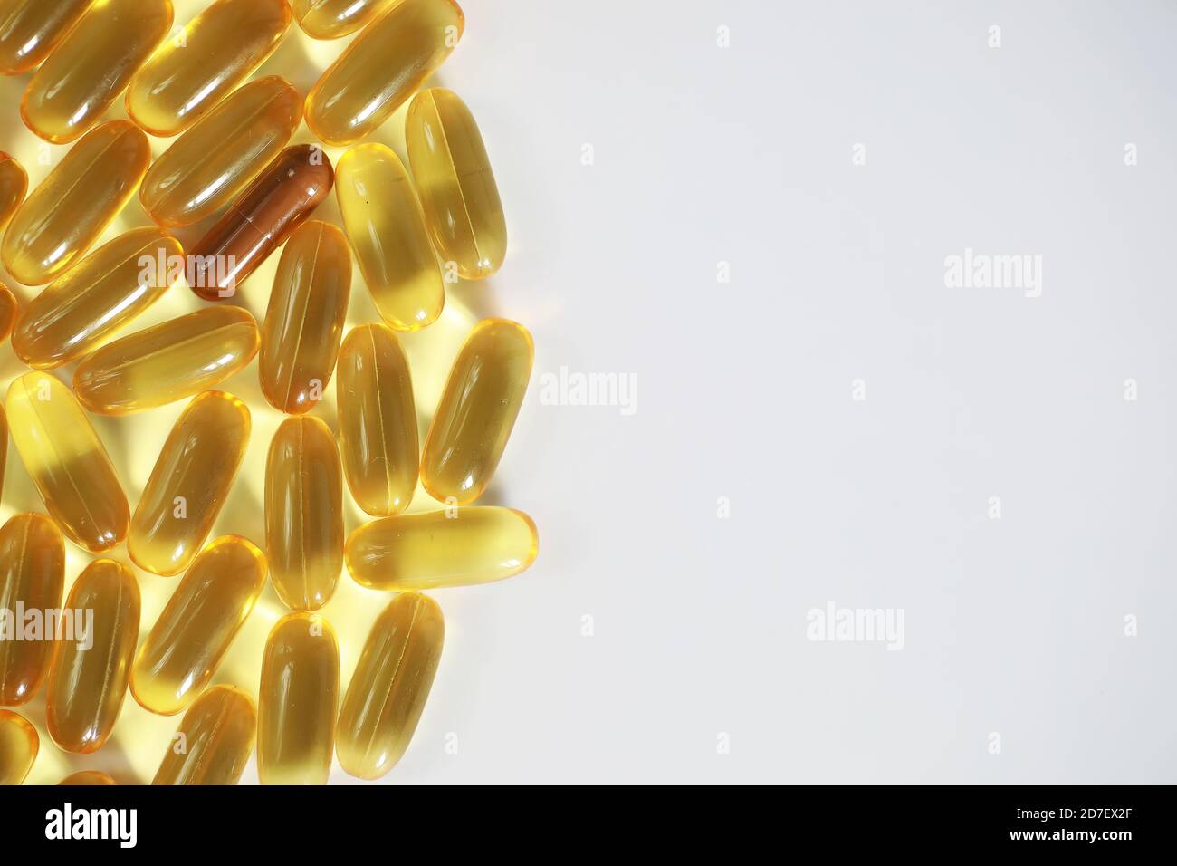 Golden color oil supplements hi-res stock photography and images - Alamy
