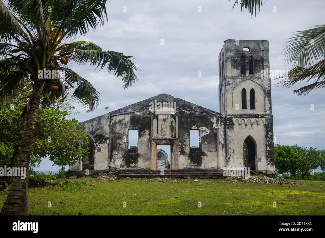 Falealupo Ruins surrounded by greenery under a cloudy sky in Samoa ...