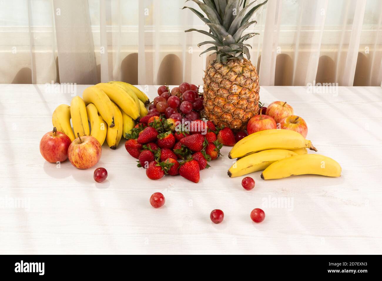 delicious fresh fruits on a white background and sun, pineapple ...