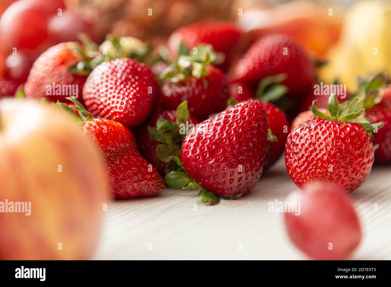 closeup of delicious fresh fruits, apple, strawberry, grapes, healthy ...