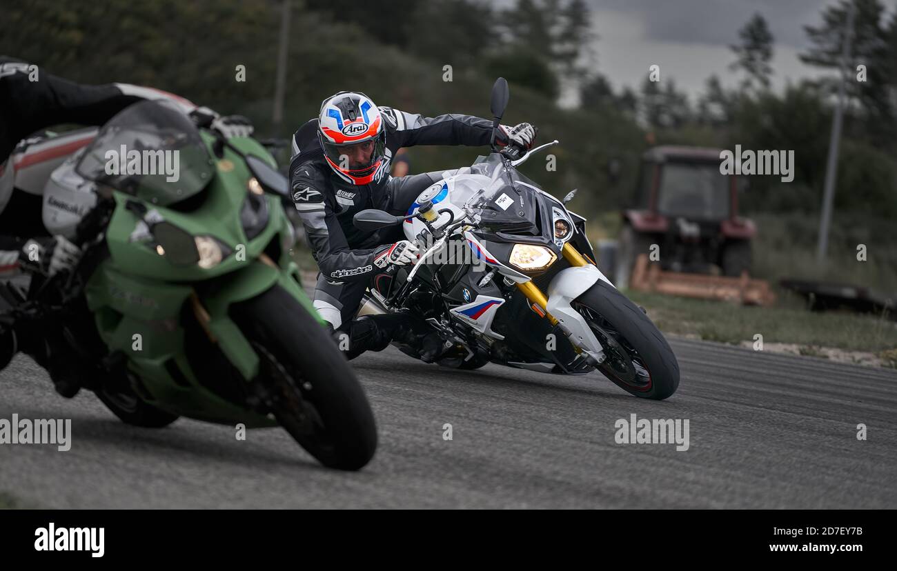 12-09-2020 Riga, Latvia man riding motorcycle in asphalt road ...