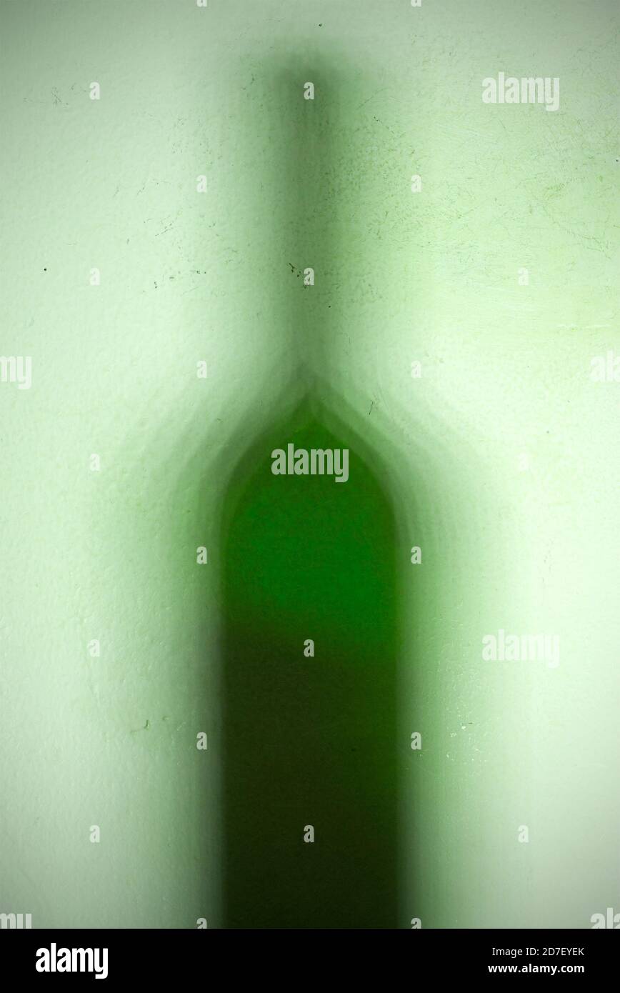 A wine bottle shadow on the wall. Whine bottle silhouette in blur Stock ...