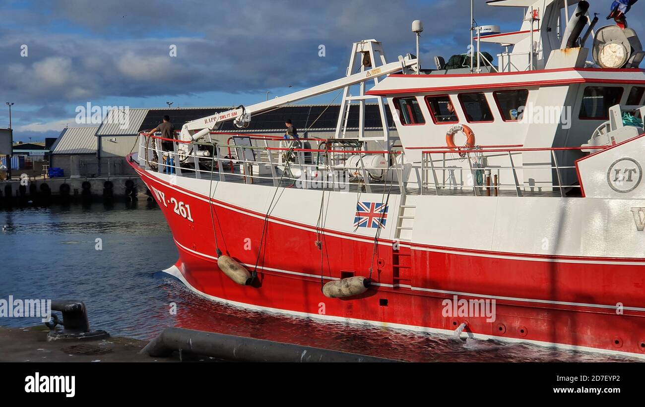 Red fishing boat at Peterhead fish market Stock Photo - Alamy