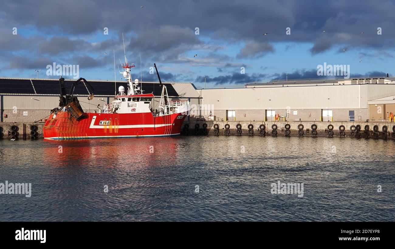 Red fishing boat at Peterhead fish market Stock Photo - Alamy