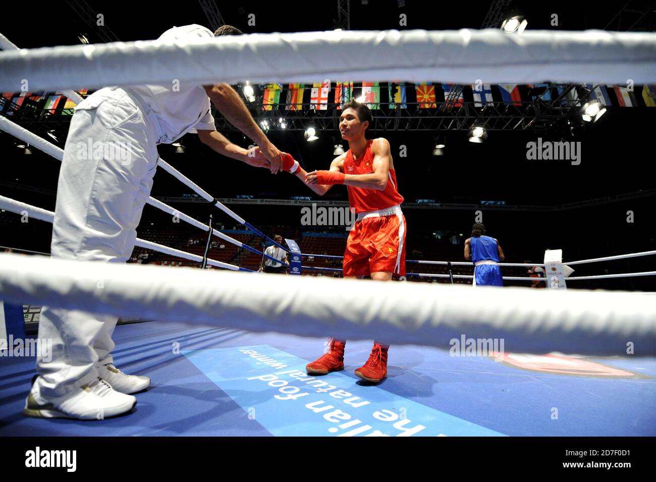 Referee and boxers during an amateur boxe match during the AIBA World ...