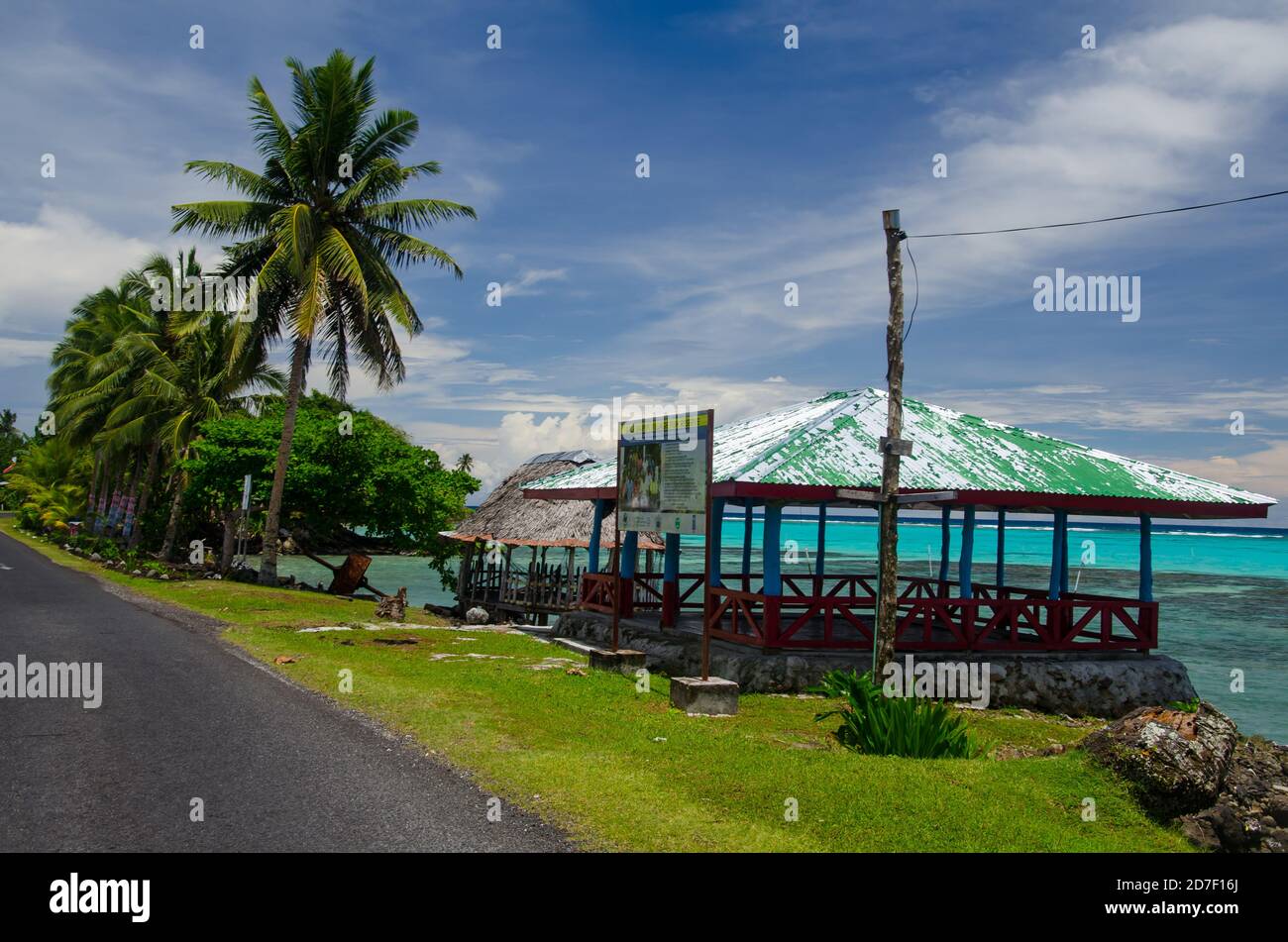 Beach fales surrounded by greenery and sea under the sunlight in Savai ...