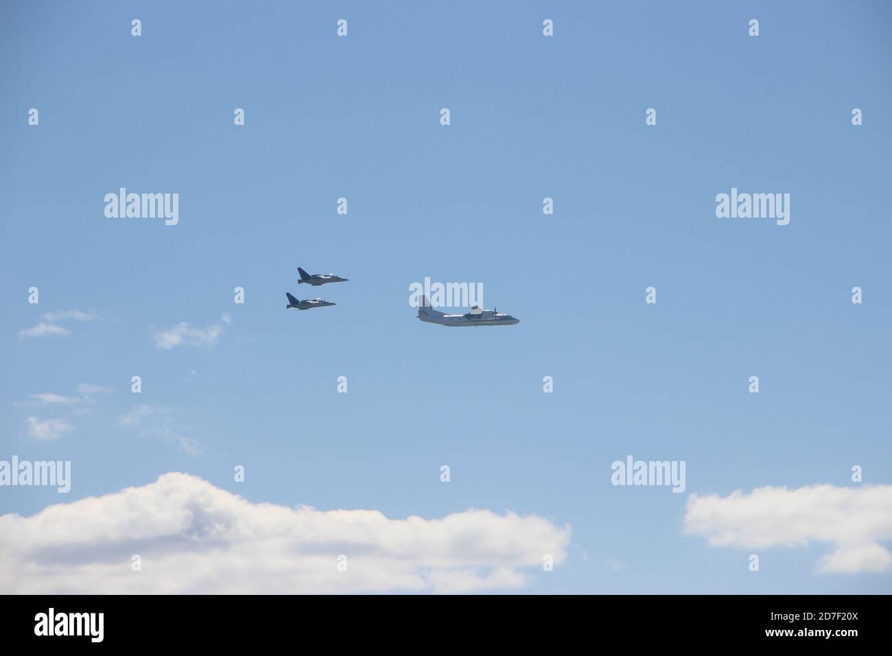 Three military Spitfire fighters silhouettes in blue sky with white ...