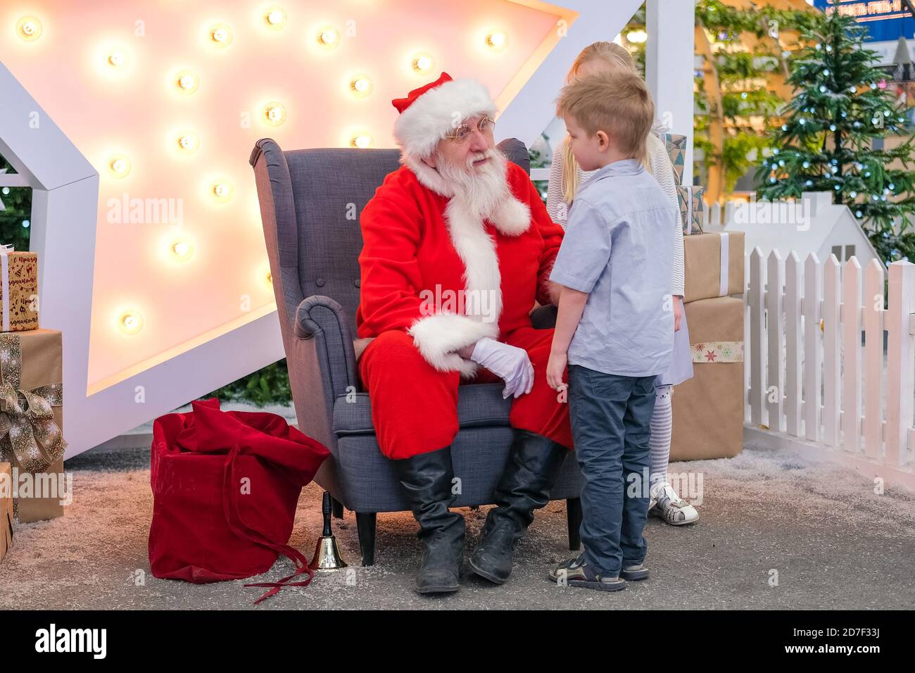 Santa Claus talking and playing surprise games with kids in Shopping ...