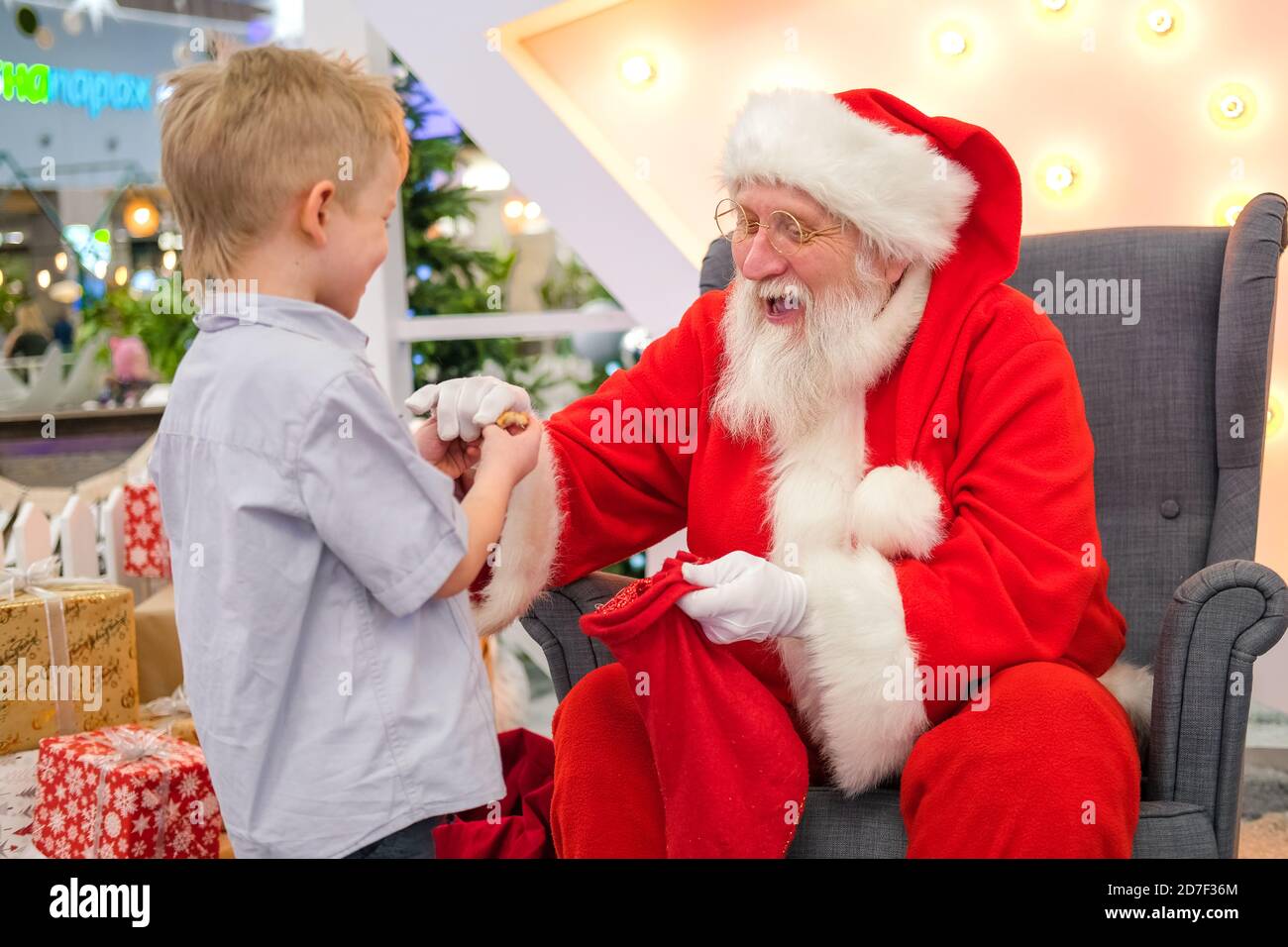 Santa Claus talking and playing surprise games with kids in Shopping ...