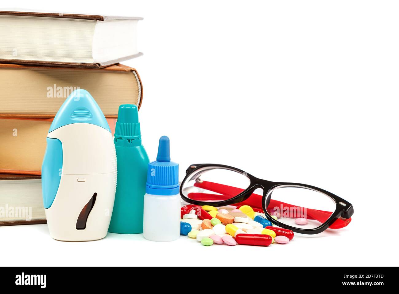 Stack of books and pills, capsules isolated on white background ...