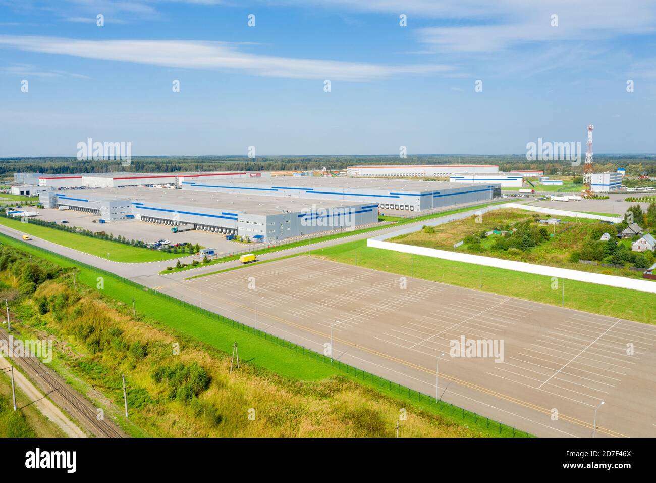Aerial view of warehouse buildings of business park in countryside ...