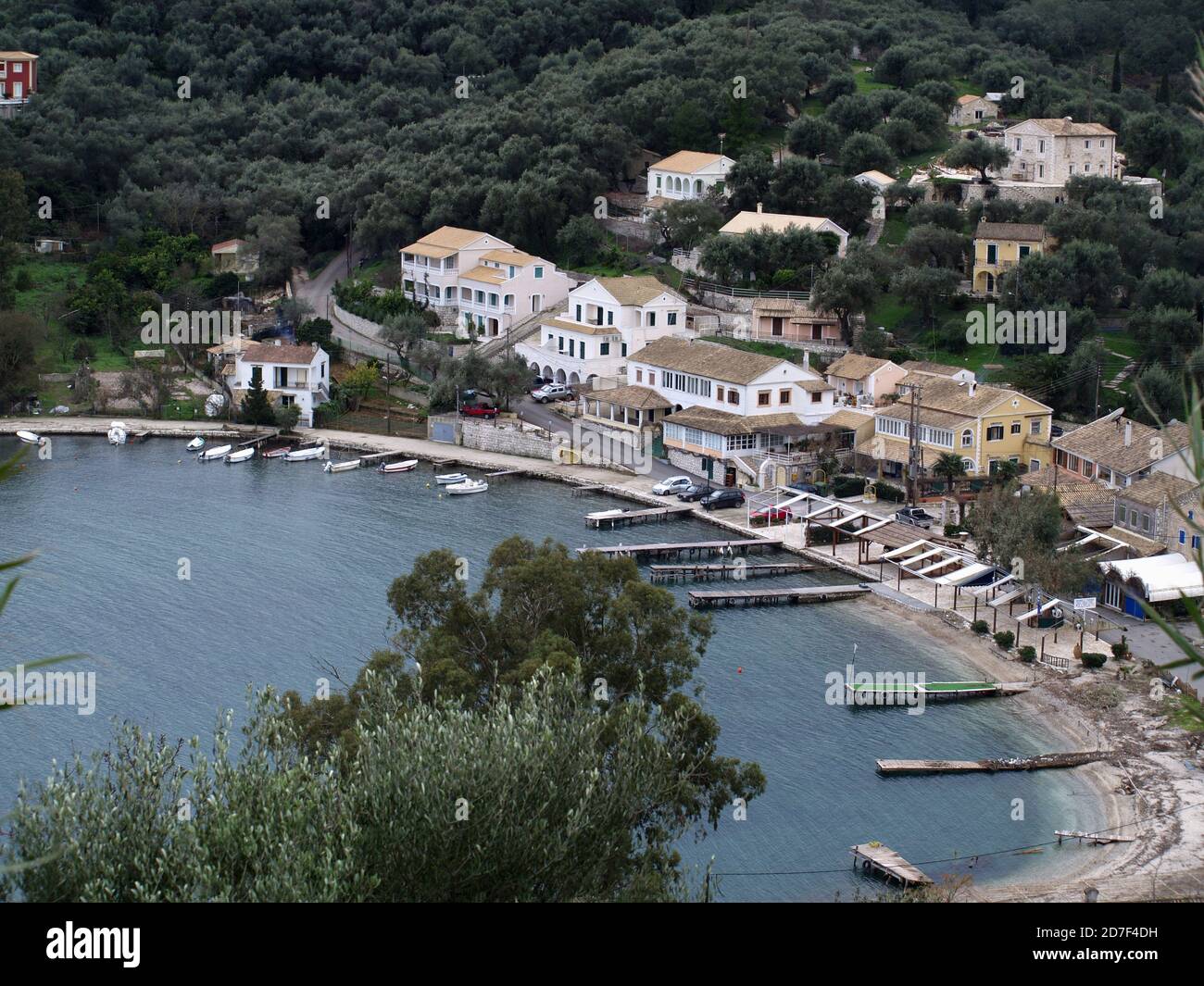 Looking down on the traditional Greek village harbour of Agios Stefanos ...
