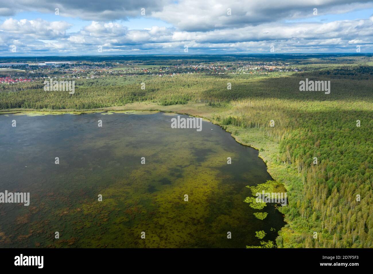 Aerial view of the countryside and a circular lake in the middle of the ...