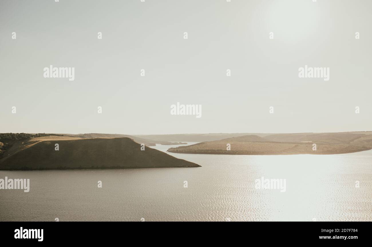 Islands in middle of sea at sunset Stock Photo - Alamy