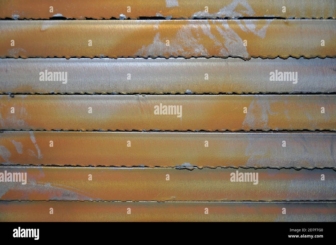 Metal cutting. Background from the edges of metal parts, cut using ...