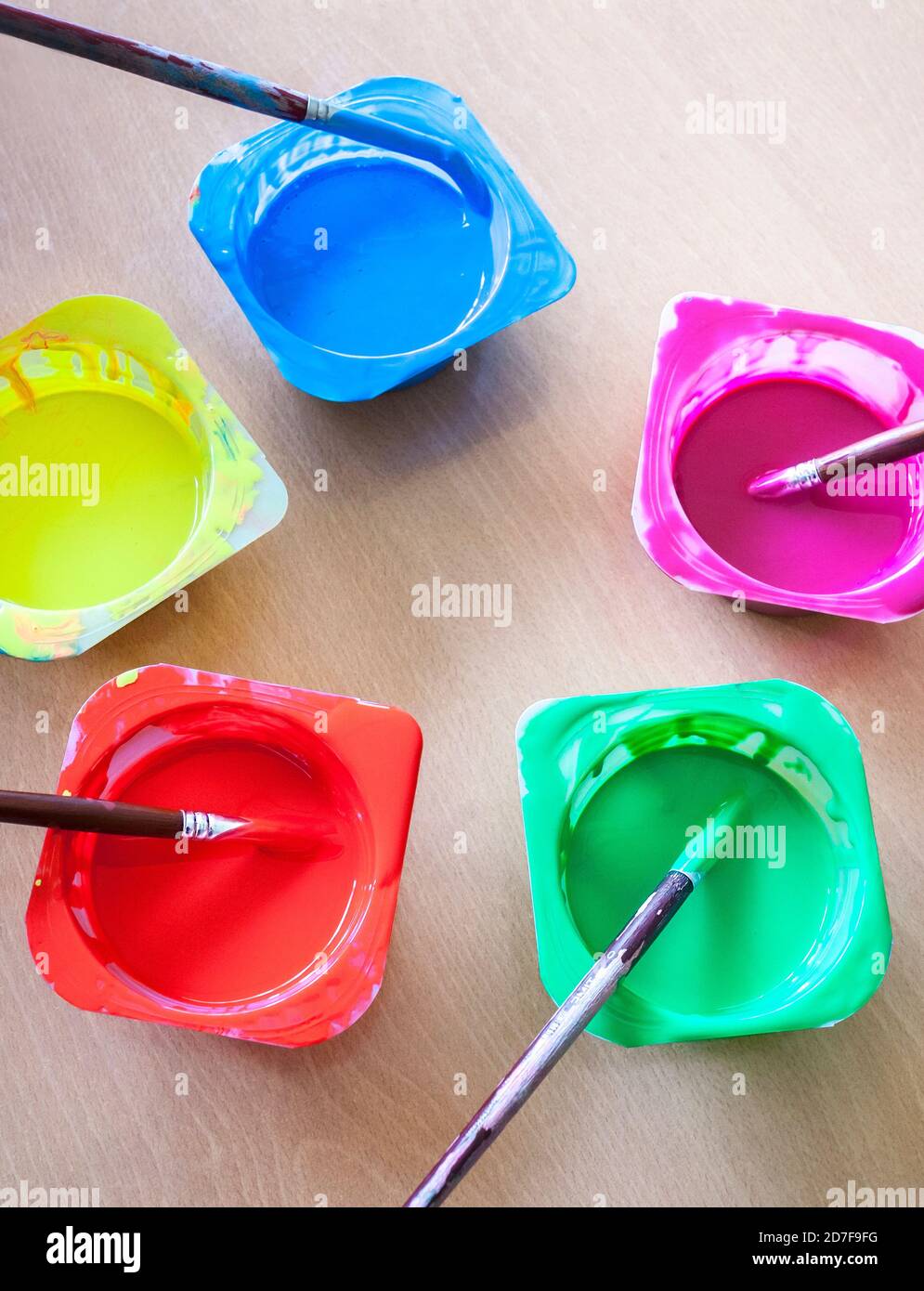 Washable Tempera and rounded paint brushes. Yogurt cups reused as paint ...