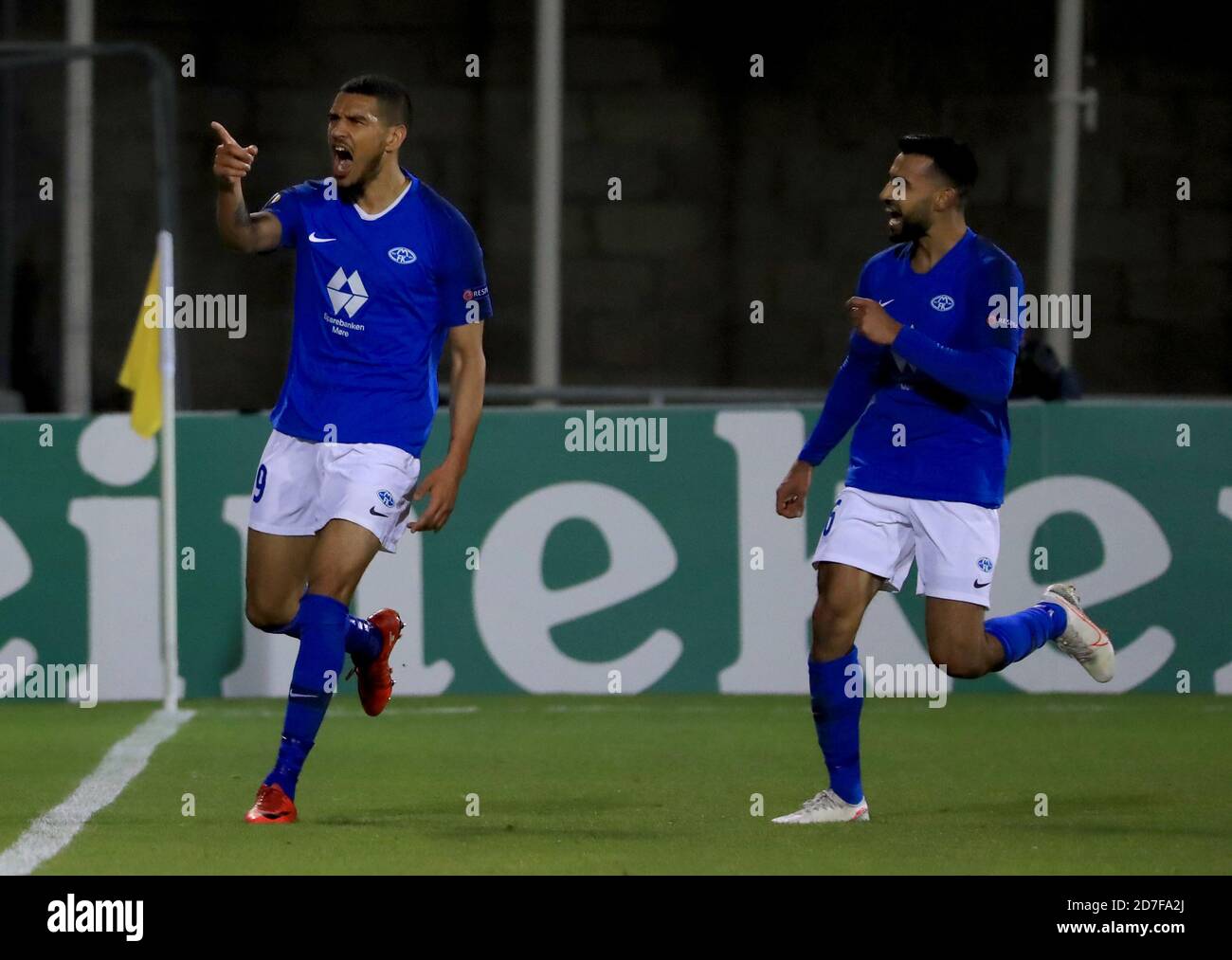 Molde's Ohi Omoijuanfo (left) celebrates scoring his side's second goal ...