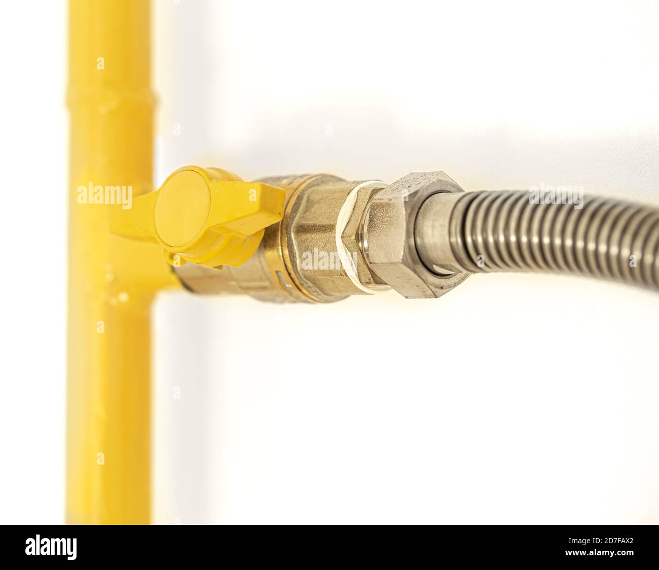 Yellow gas pipe with a valve. White background. Space for text Stock ...