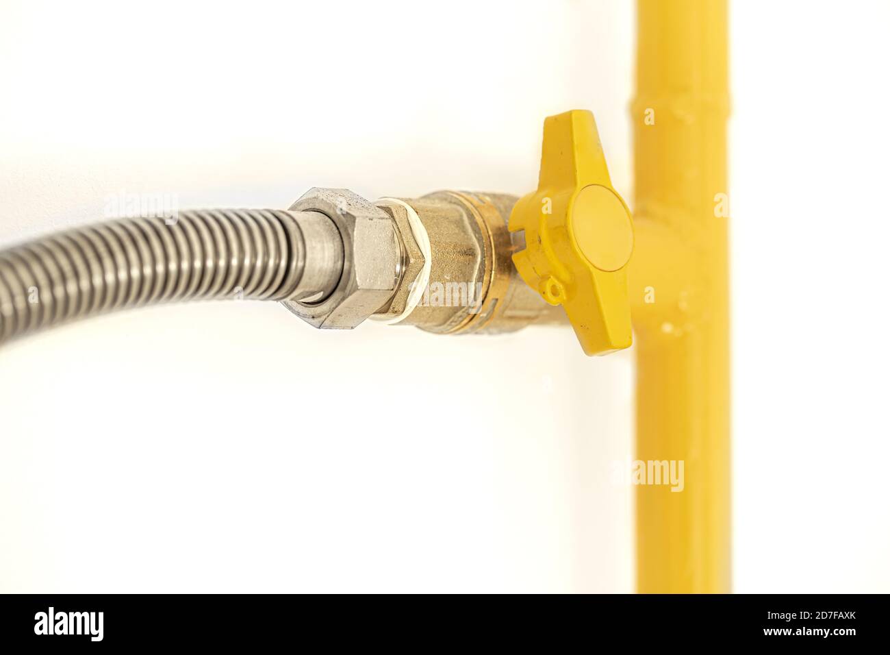 Yellow gas pipe with a valve. White background. Space for text Stock ...