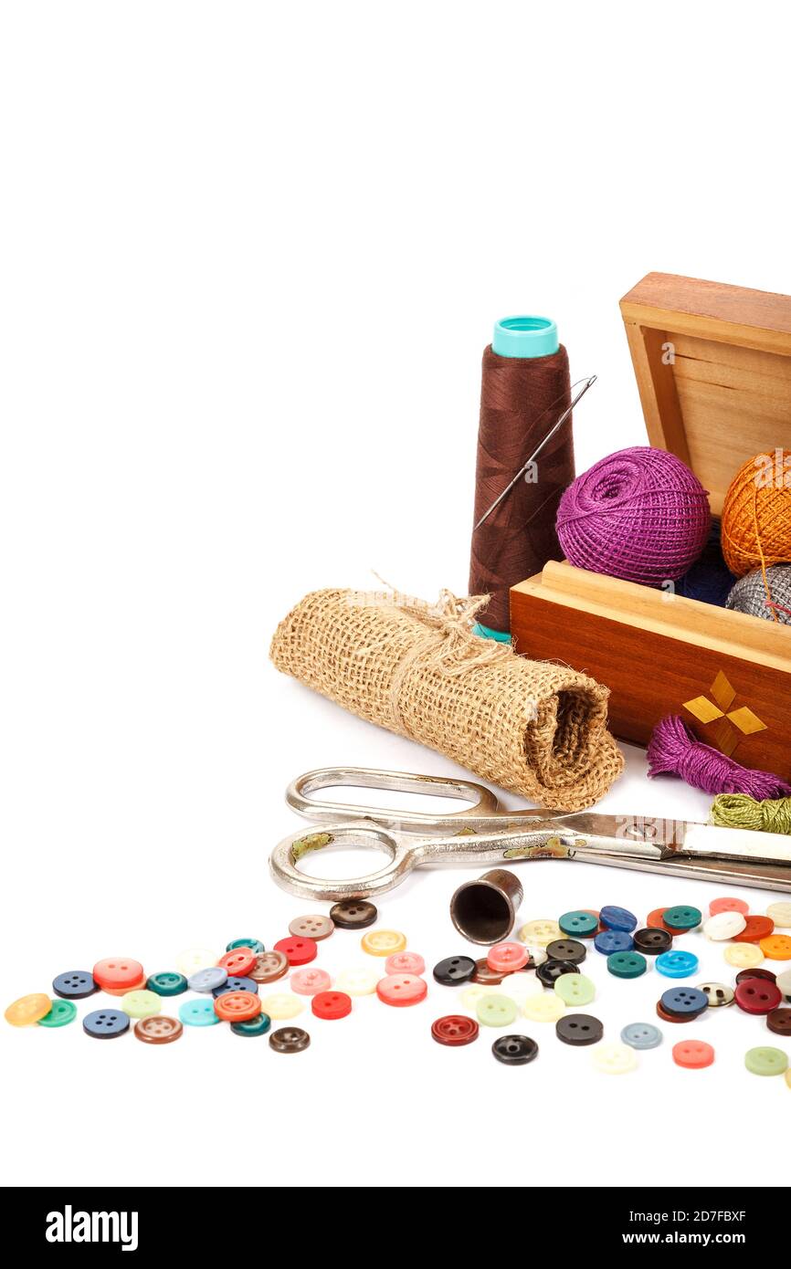 Thread, buttons, scissors isolated on white background. Sewing supplies ...