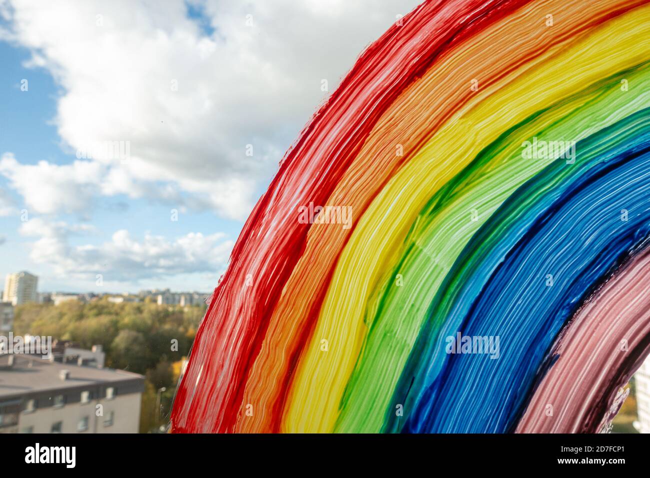 Colorful rainbow painted on window during coronavirus infection ...