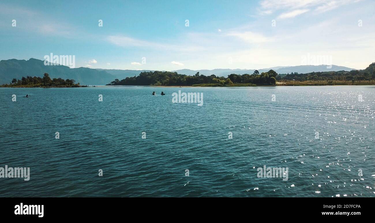 Aerial view of a small boat sailing at the Lake Atitlan in Guatemala ...