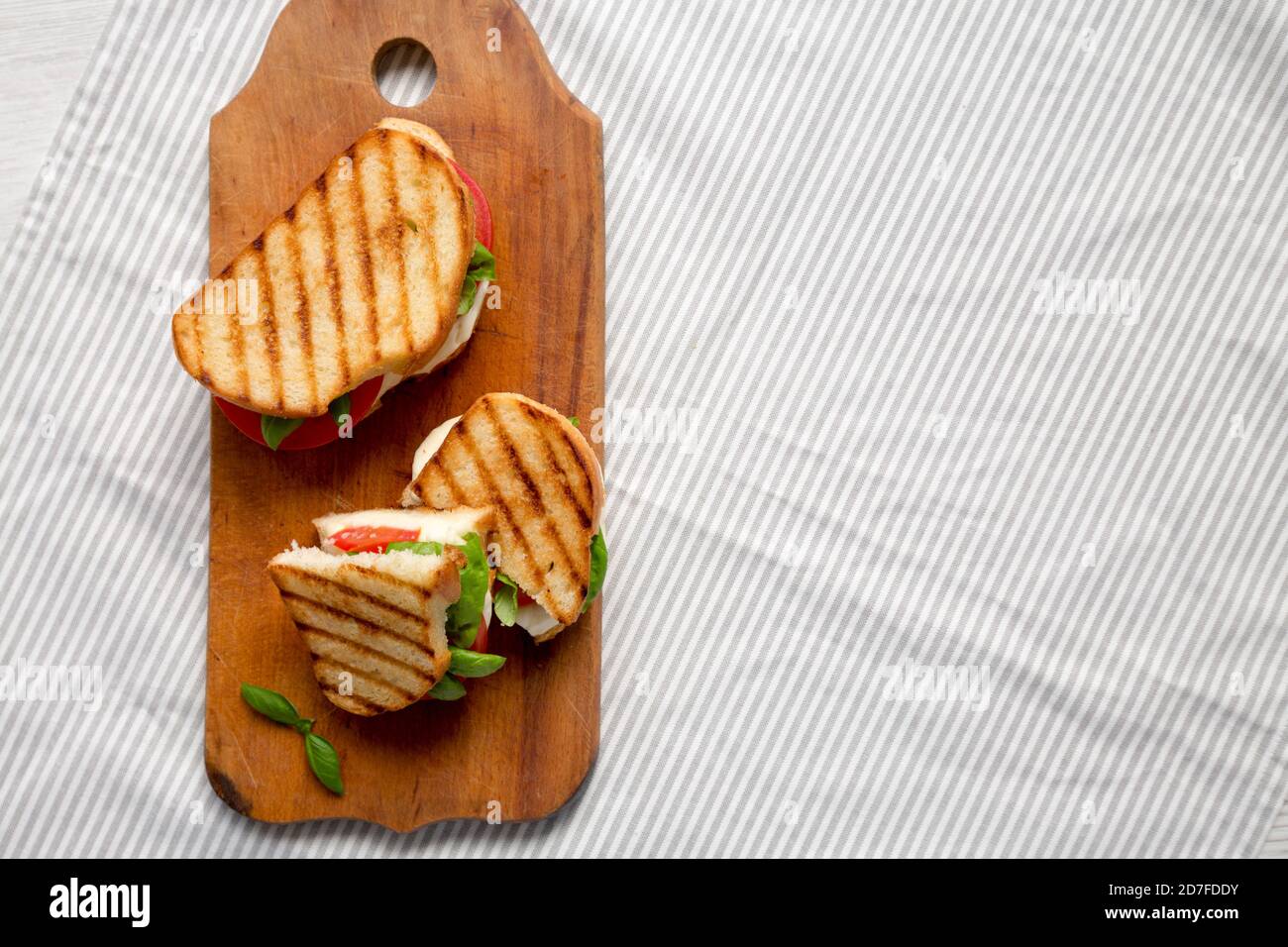 Tasty Grilled Caprese Panini (Mozzarella, Tomatoes and Basil) on a ...