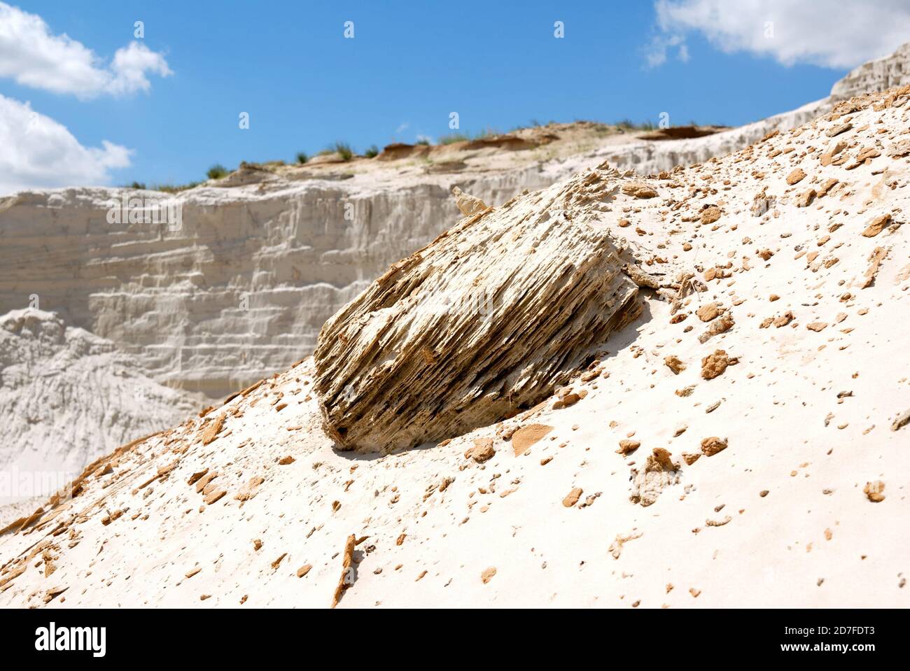 Sculptures from sand against a slope of sandy mountain Stock Photo - Alamy