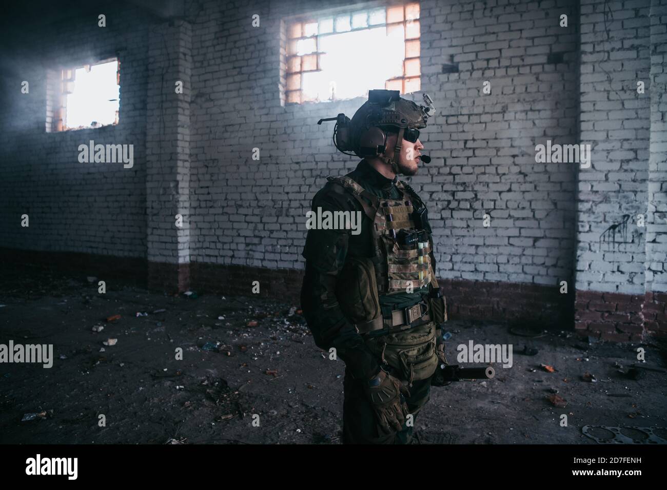 Military men with arms defending the building. Soldier stand guard ...