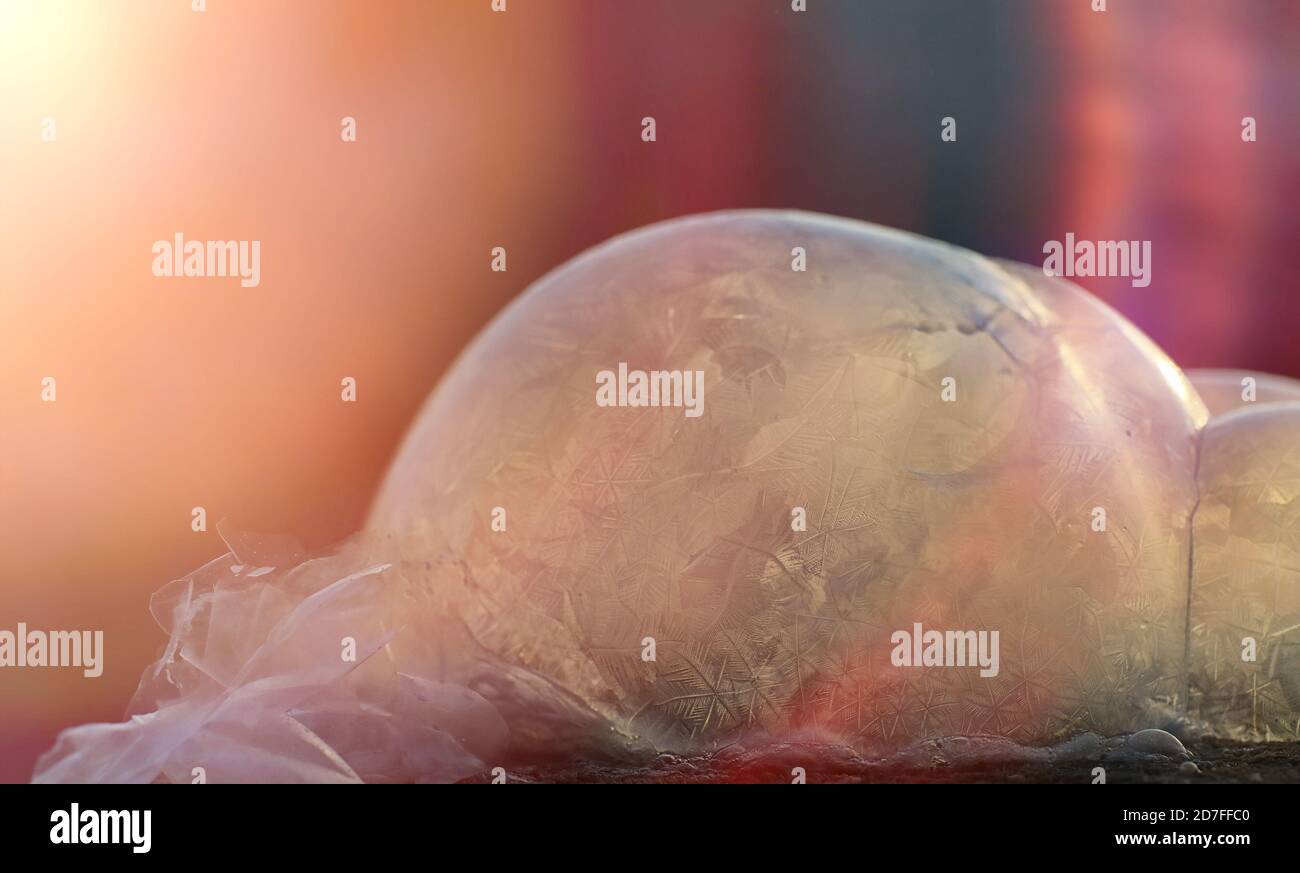 Soap bubbles freeze in the cold. Winter soapy water freezes in air ...