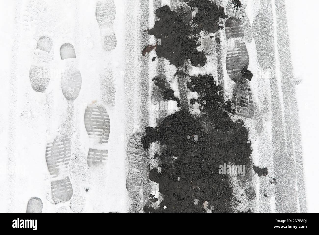 Footprints in the snow. Footprints on the first snow. Imprint of shoes ...